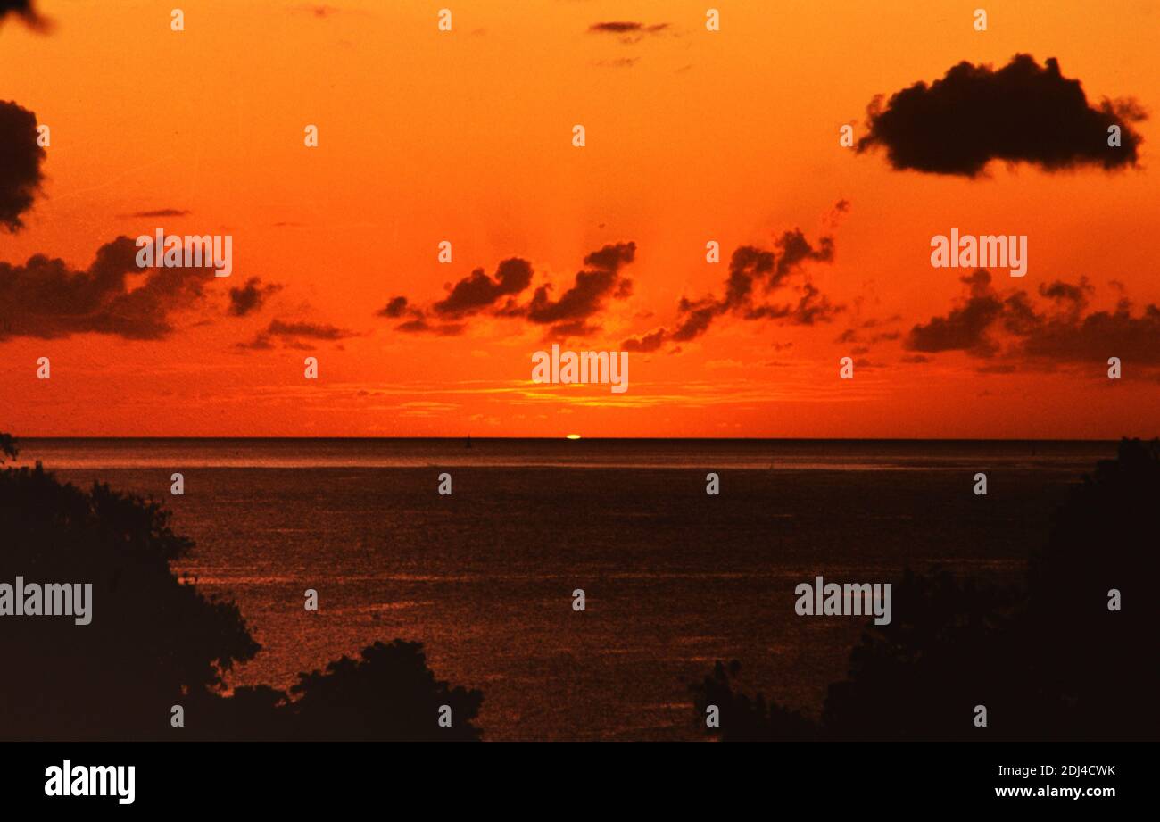 1990s St. Lucia (Eastern Caribbean) - Setting sun over ocean seen from ...