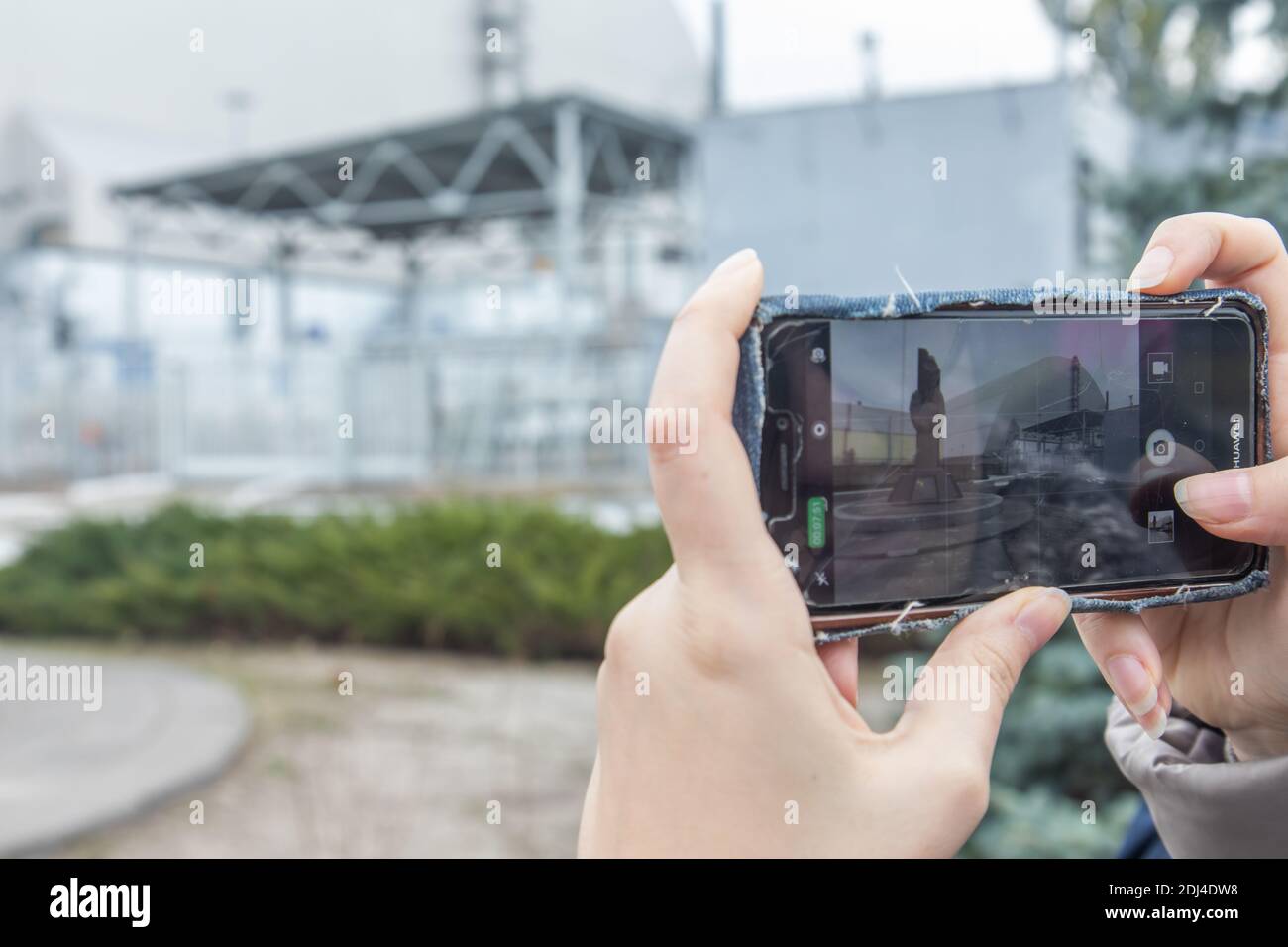 Chernobyl, Ukraine - November 3, 2019: A girl takes a photo to the ...