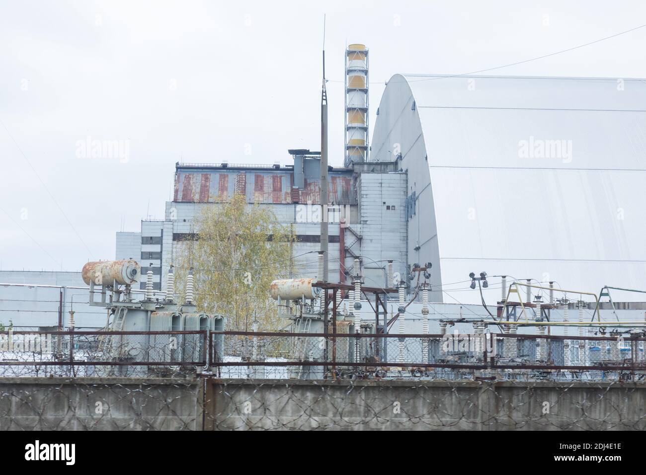 The nuclear power plant, where a protective shelter covers the reactor ...
