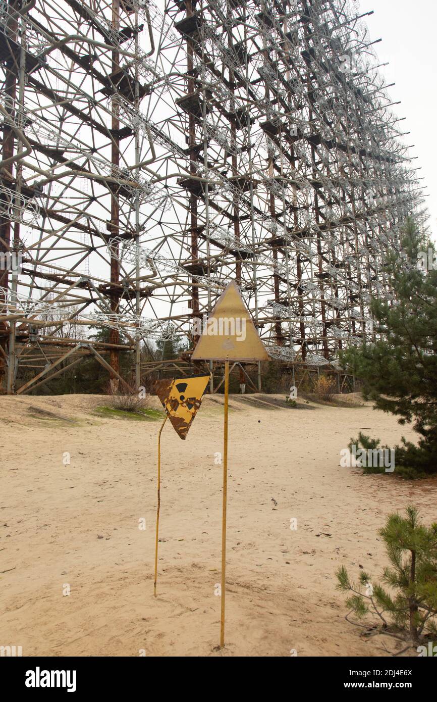 Rusty nuclear hazard sign in front of Duga system, a Soviet over the ...