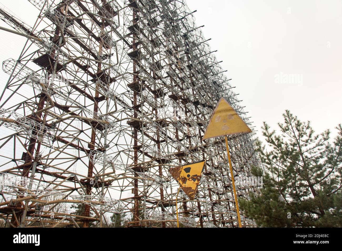 Rusty nuclear hazard sign in front of Duga system, a Soviet over the ...