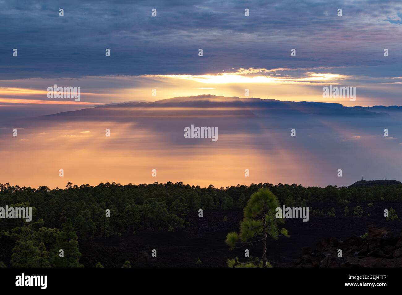 Sunset from El Teide National Park. A cloudy sunset with the sun ...