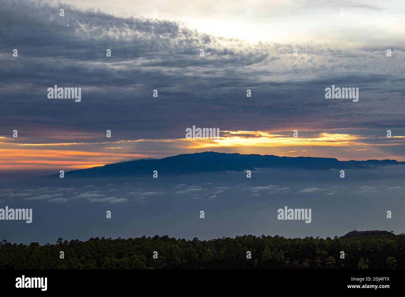 Sunset from El Teide National Park. A cloudy sunset with the sun ...