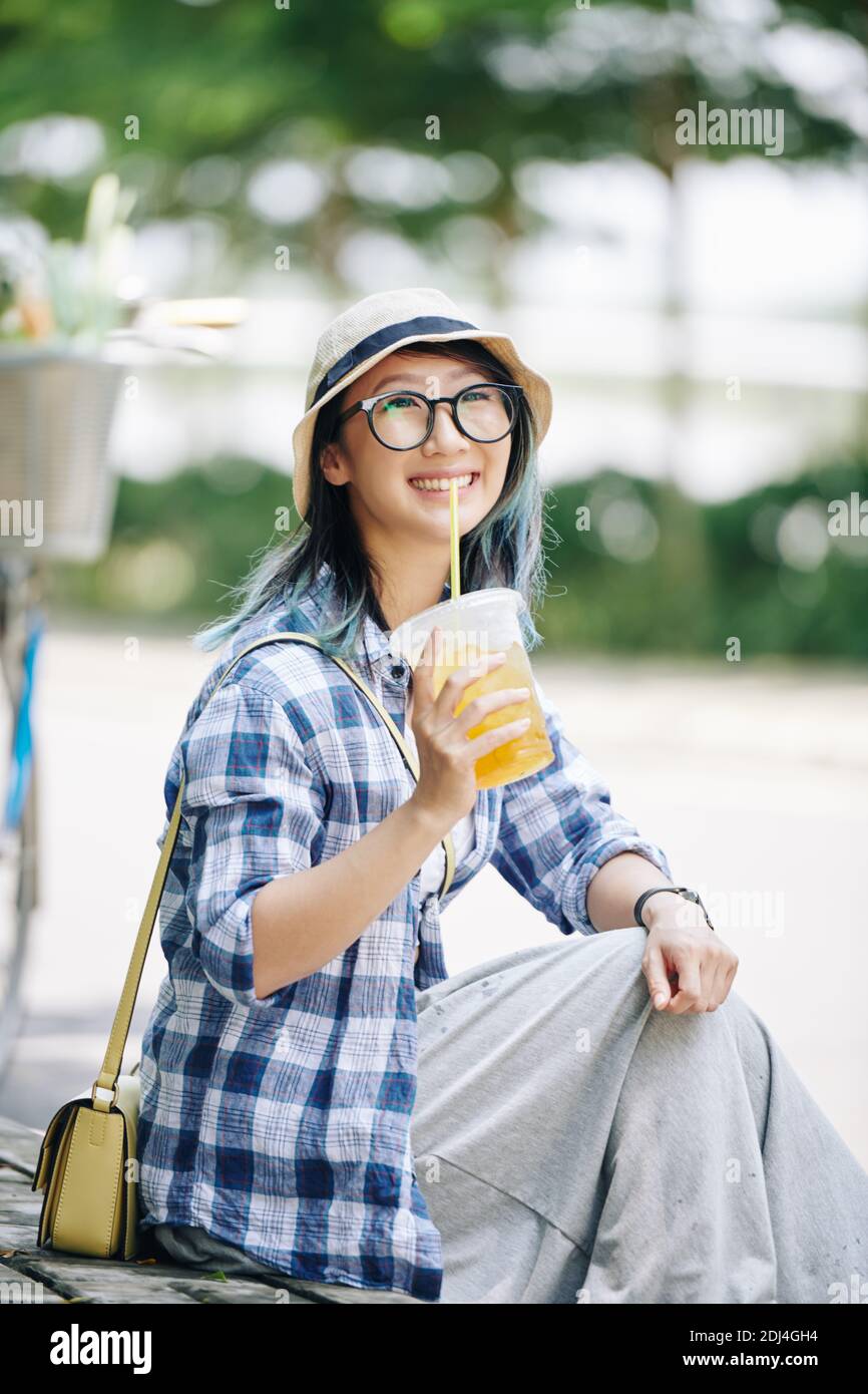 Woman drinking refreshing cocktail Stock Photo - Alamy