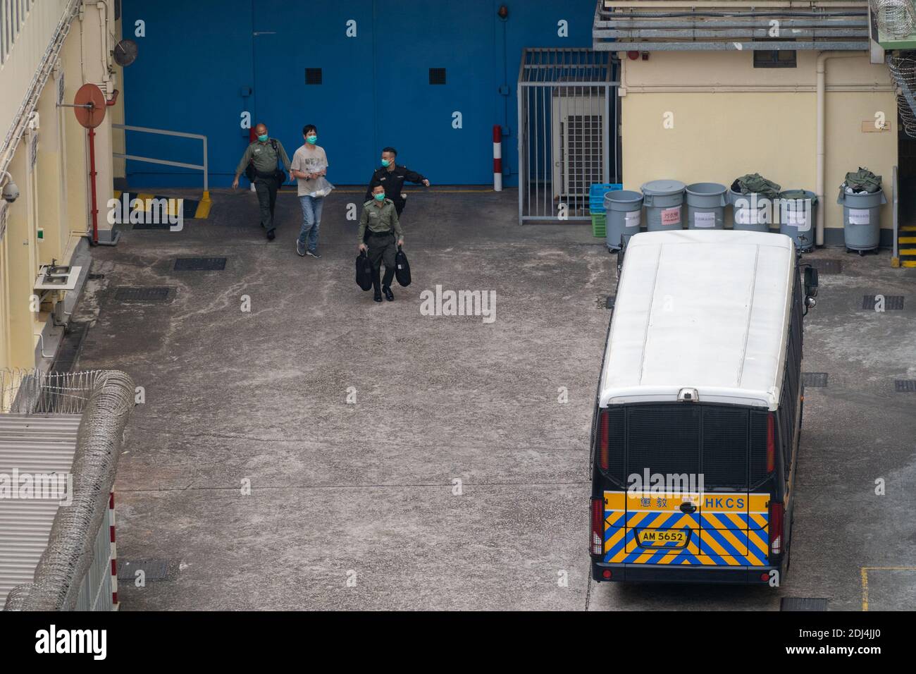 A prisoner seen being escorted to a prison van by prison guards at the ...