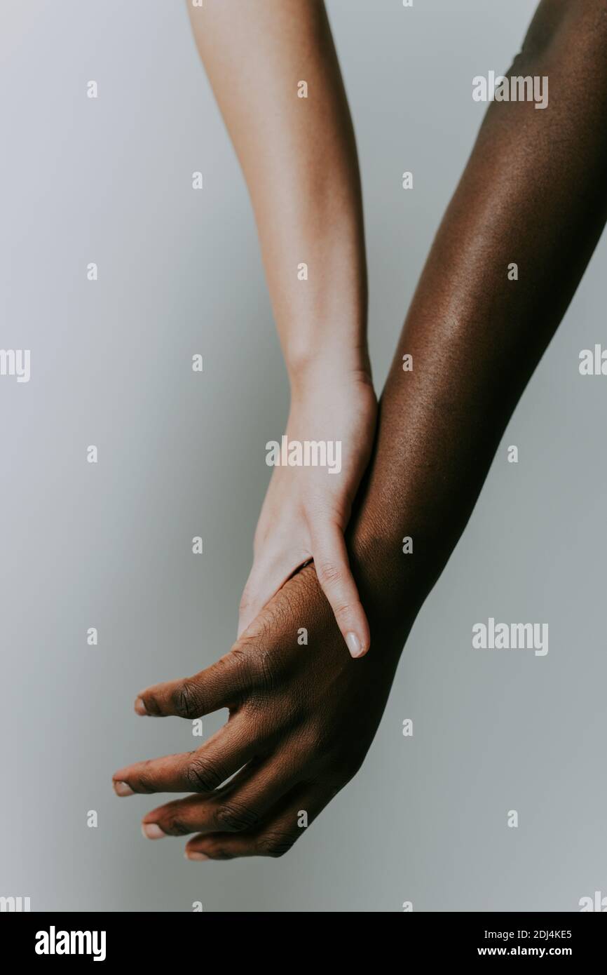 Arms of black and white women, concepts about racial integration, human ...