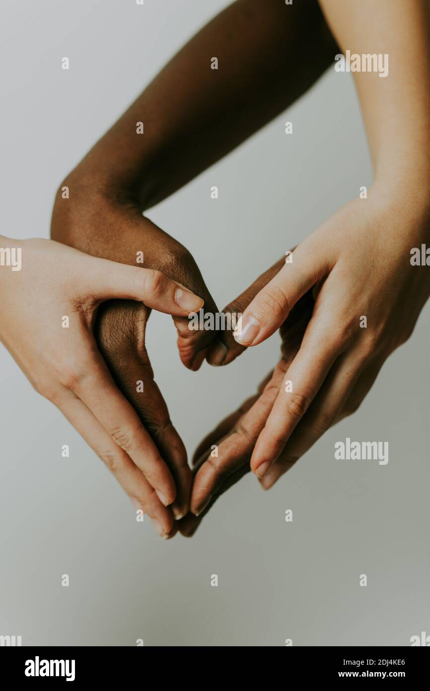Arms of black and white women, concepts about racial integration, human ...