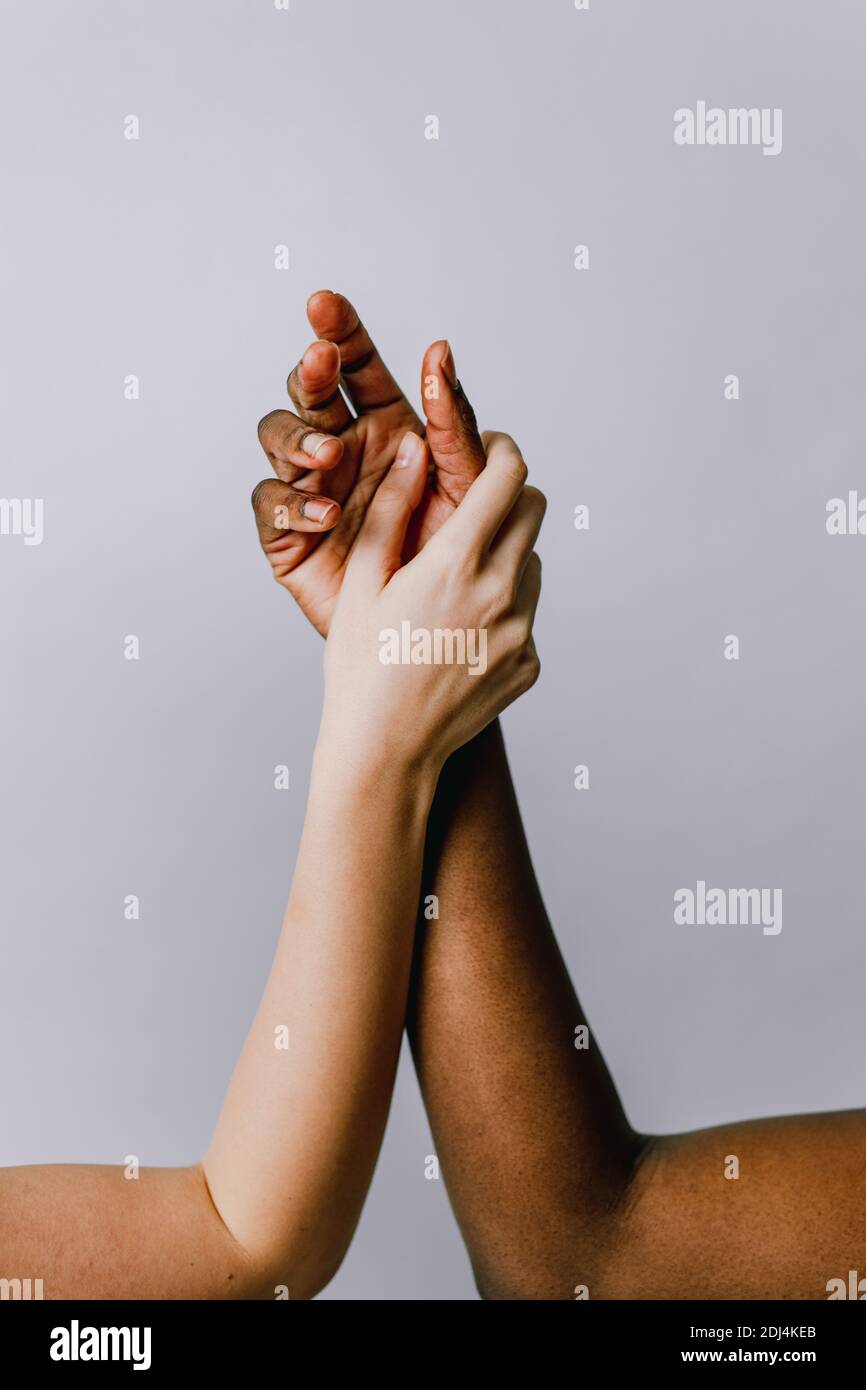 Arms of black and white women, concepts about racial integration, human ...