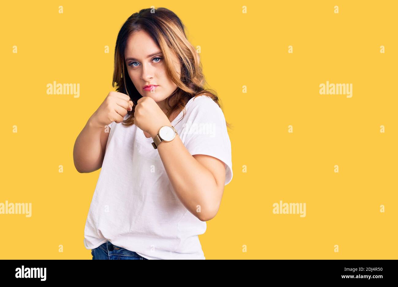 Young beautiful caucasian woman wearing casual white tshirt ready to ...