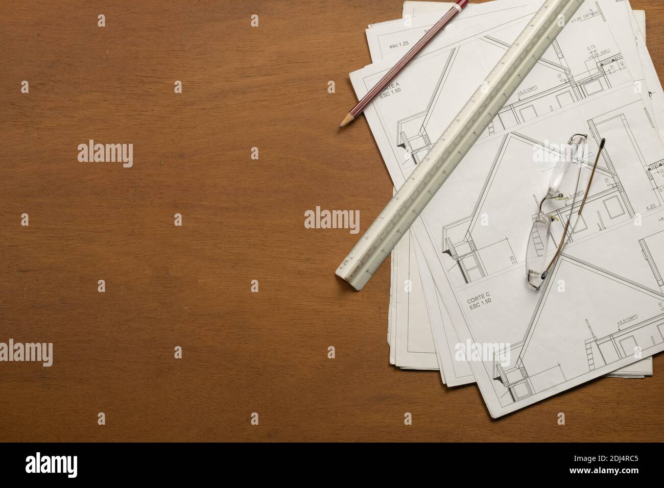 Work plan and drawing elements on wooden table Stock Photo - Alamy