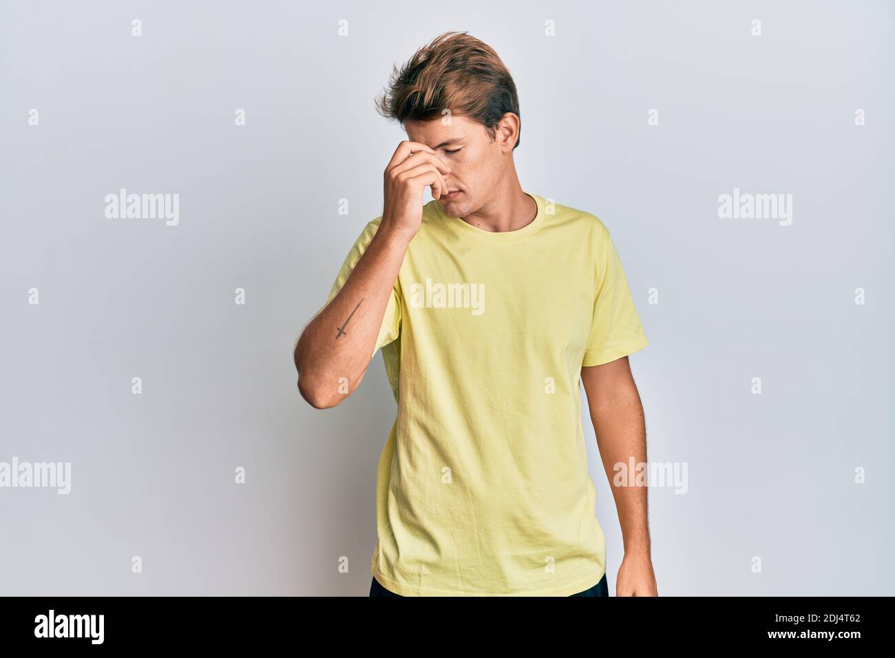Handsome caucasian man wearing casual clothes tired rubbing nose and ...