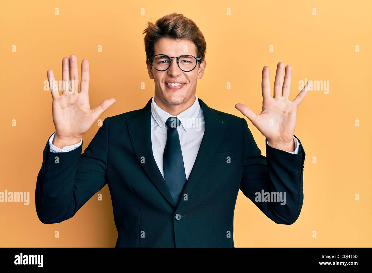 Handsome caucasian man wearing business suit and tie showing and ...