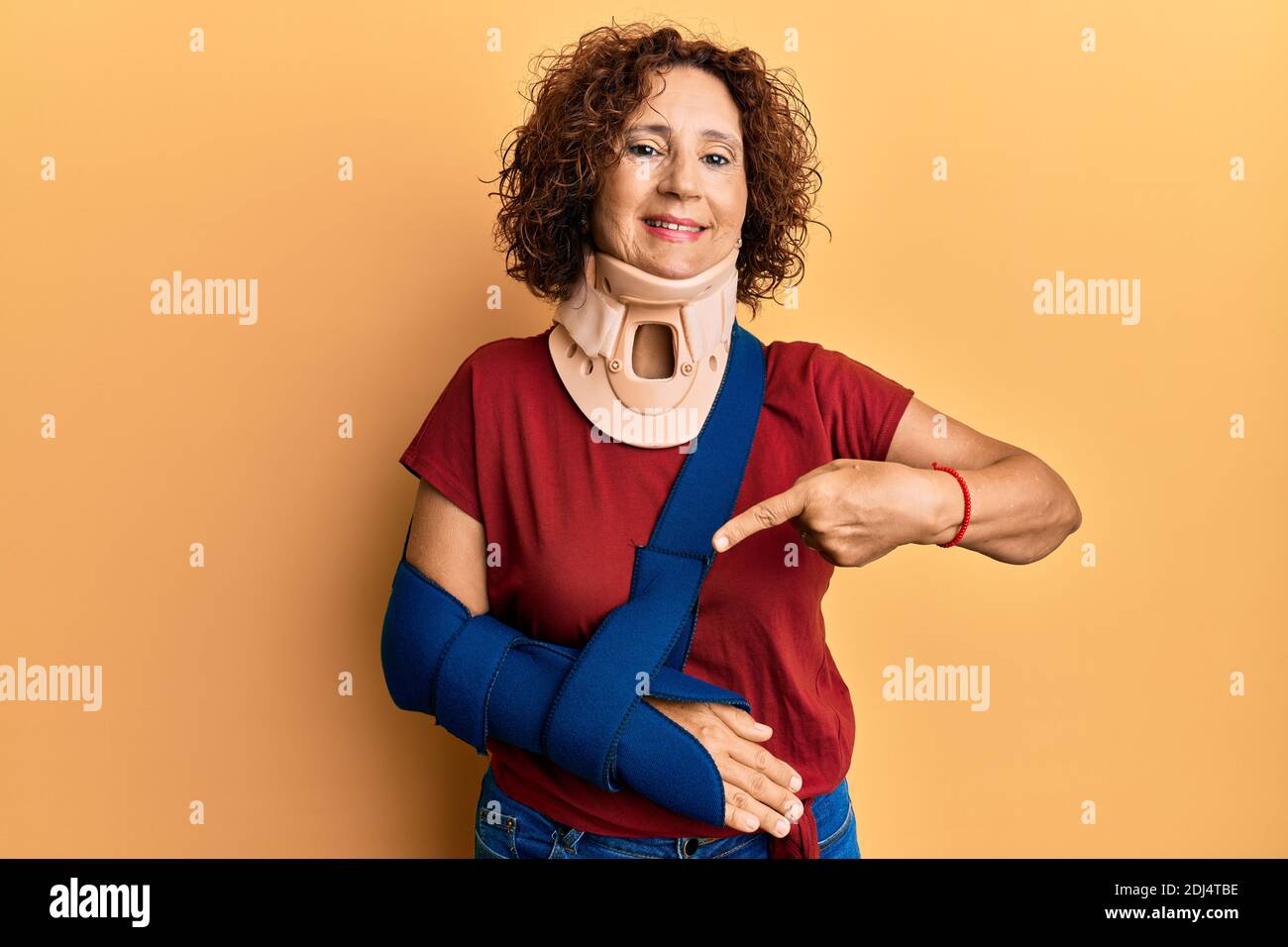Beautiful middle age mature woman wearing cervical collar and arm on ...