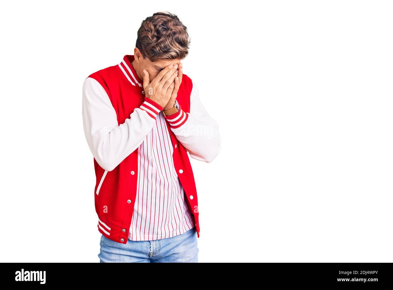 Young handsome man wearing baseball uniform with sad expression ...