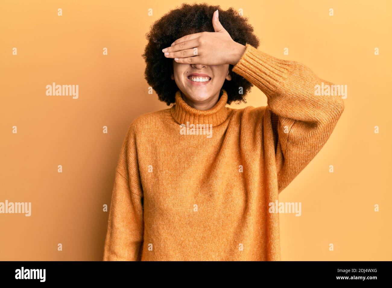 Young hispanic girl wearing wool winter sweater smiling and laughing ...