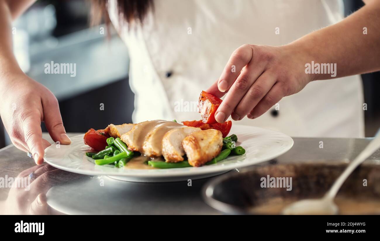 Woman prepares food in catering hi-res stock photography and images - Alamy