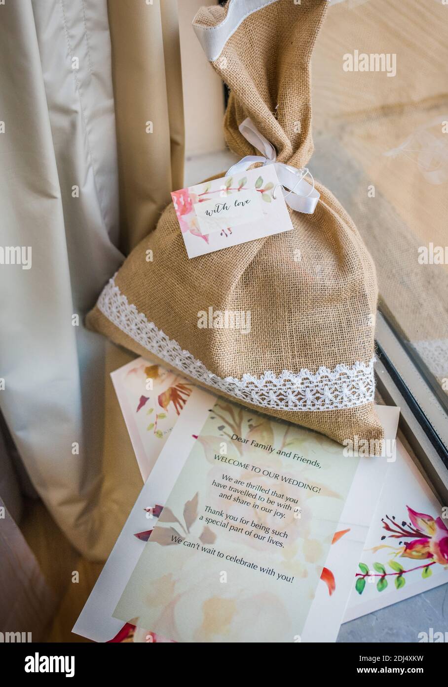 marriage invitation card with beautiful jute bag and flowers Stock ...