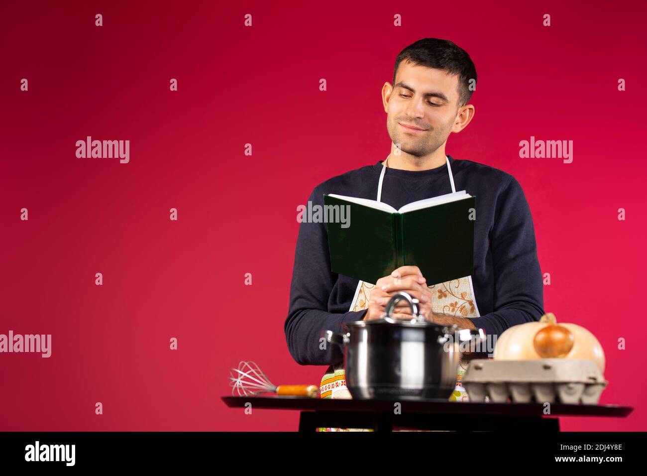 Male chef reading cookbook preparing hi-res stock photography and ...