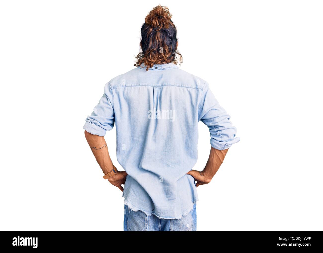 Young hispanic man wearing summer style standing backwards looking away ...