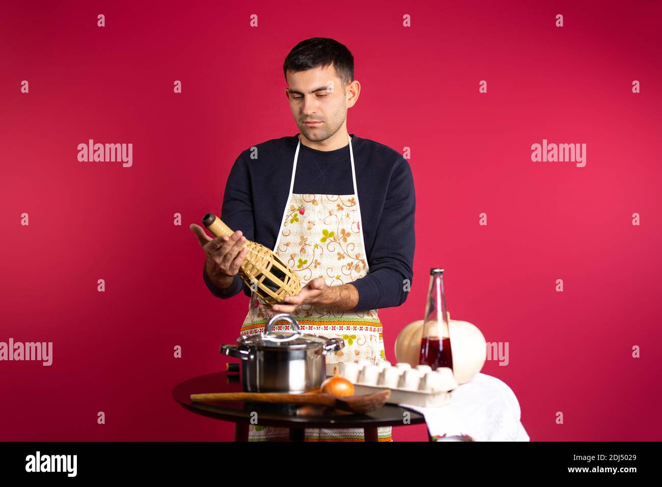 Gender stereotype. The man in the kitchen, preparing dinner and ...