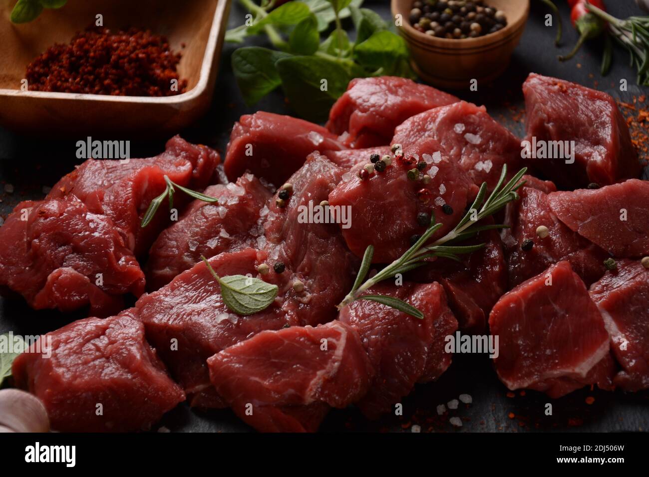 Diced raw beef with ingredients, herbs and spices Stock Photo - Alamy