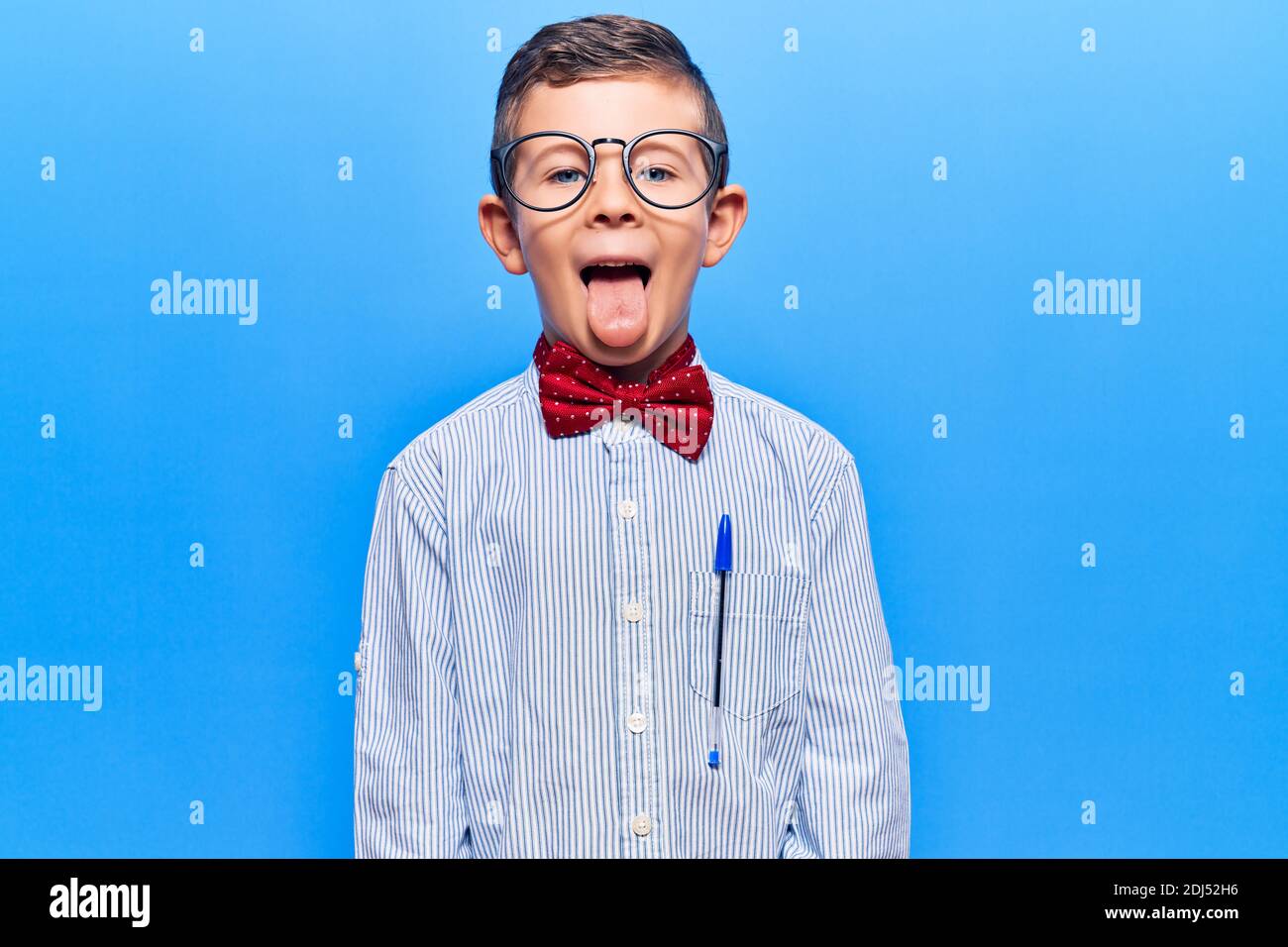 Cute blond kid wearing nerd bow tie and glasses sticking tongue out ...
