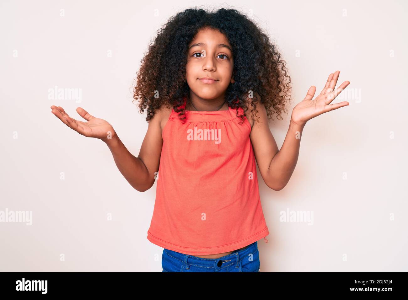 African american child with curly hair wearing casual clothes clueless ...