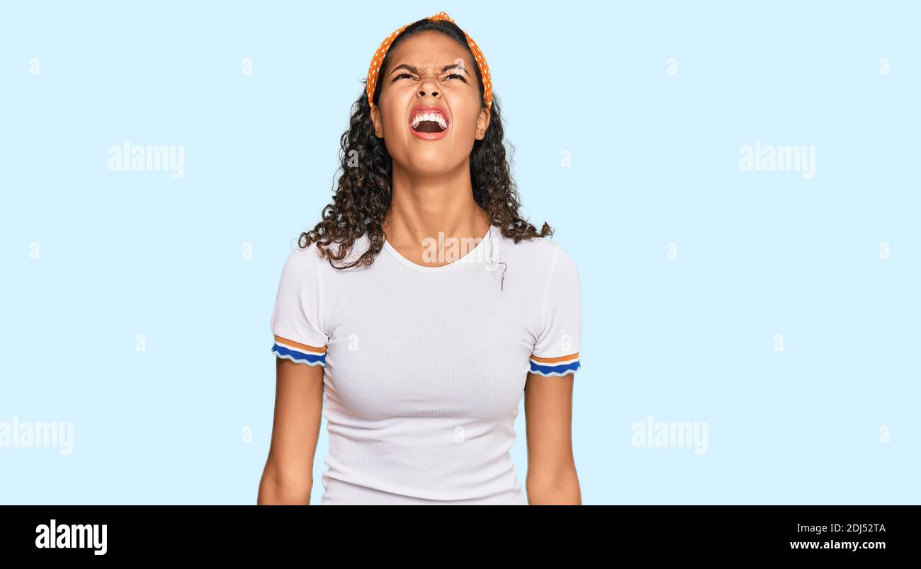 Young african american girl wearing casual clothes angry and mad ...