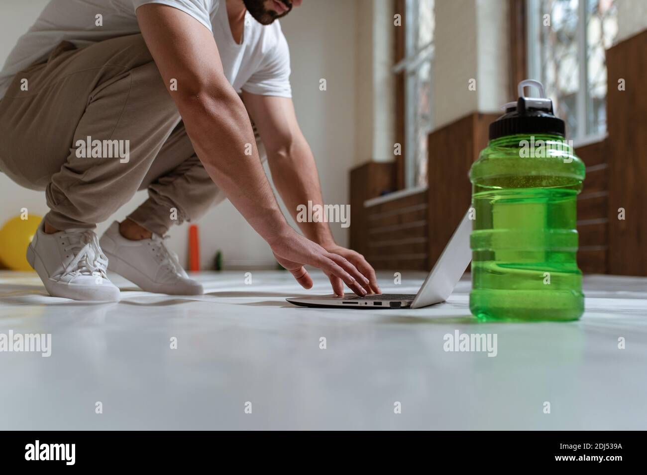 No face shot of a young man looking for online work out videos on using ...