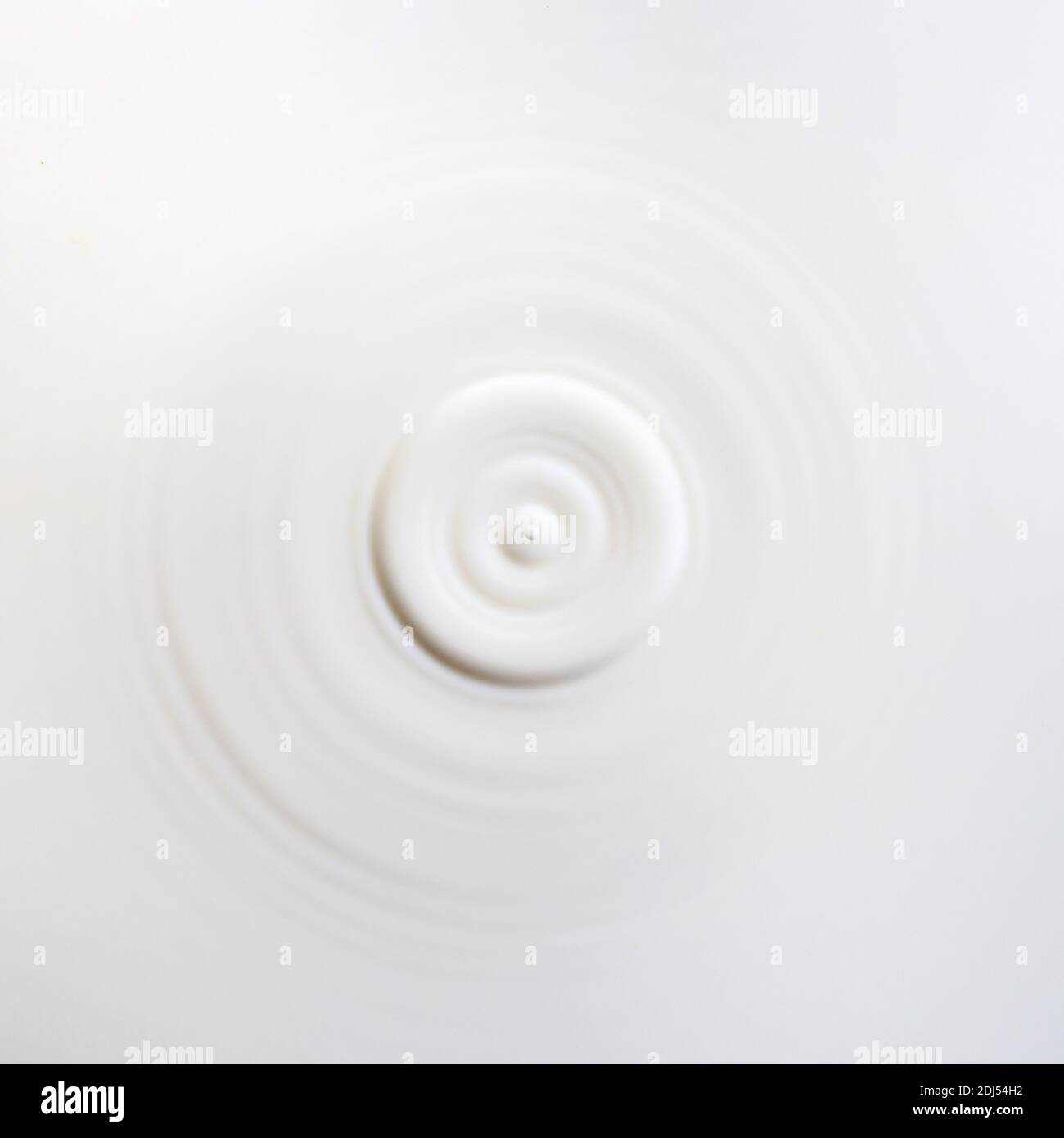 white liquid with circle ripple Stock Photo - Alamy
