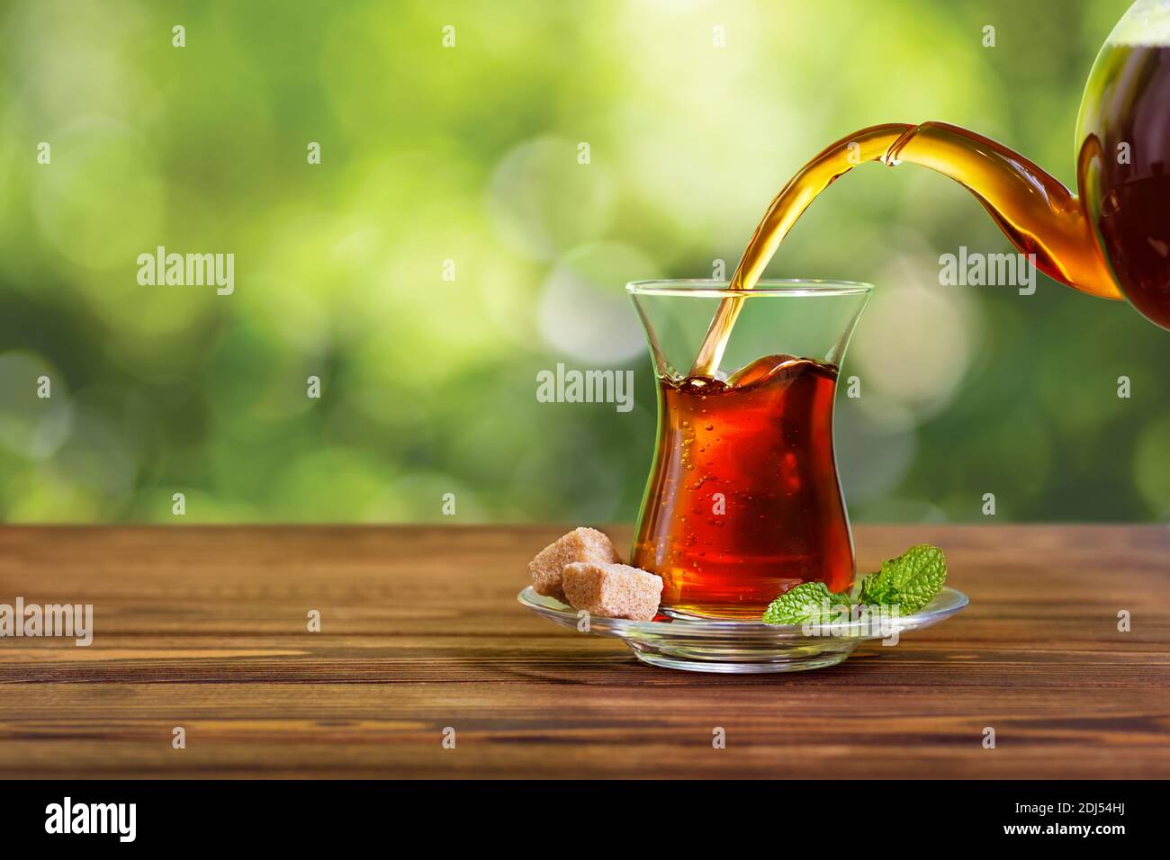 Pouring tea turkish glass cup hi-res stock photography and images - Alamy