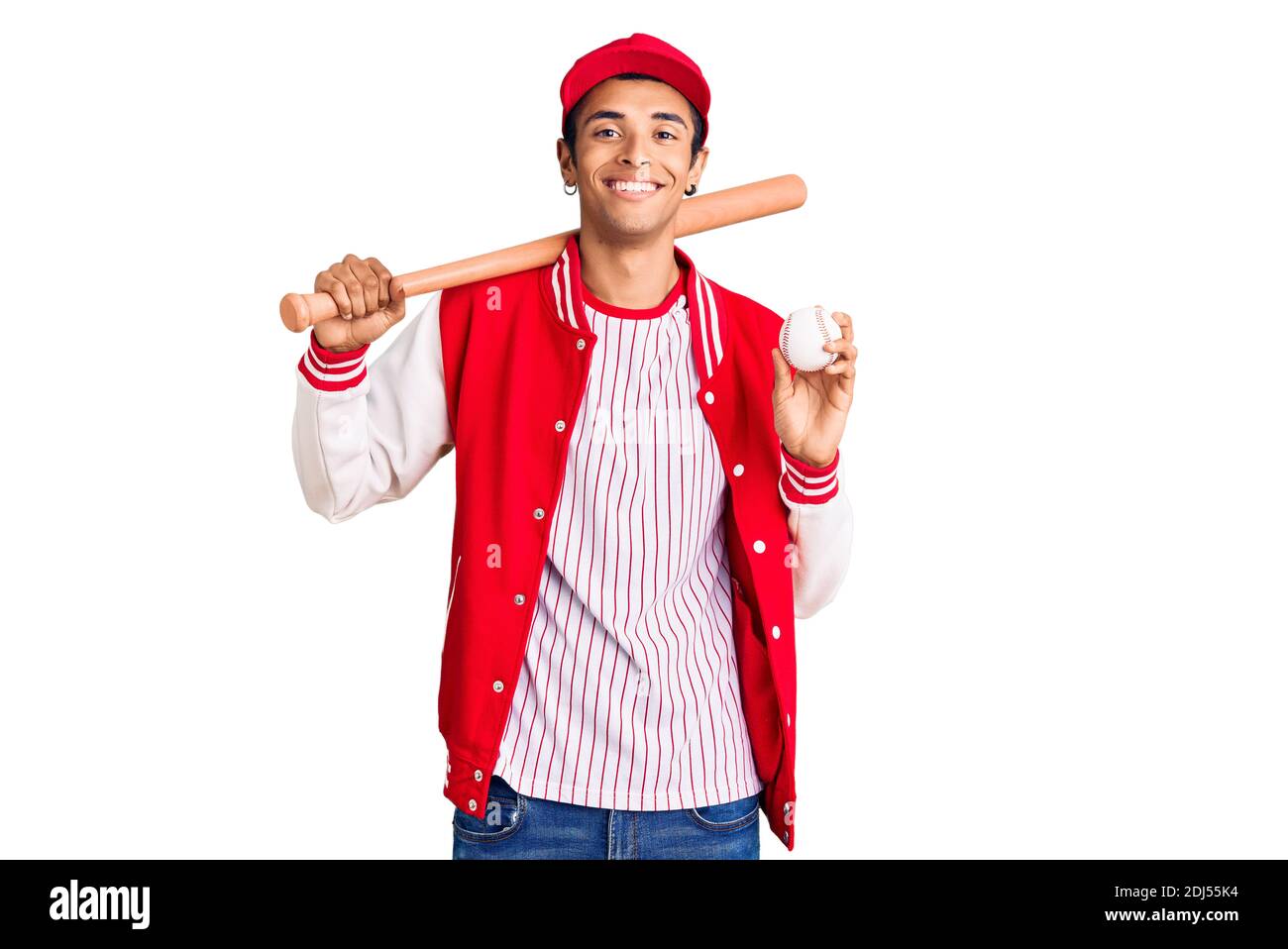 Young african amercian man playing baseball holding bat and ball ...