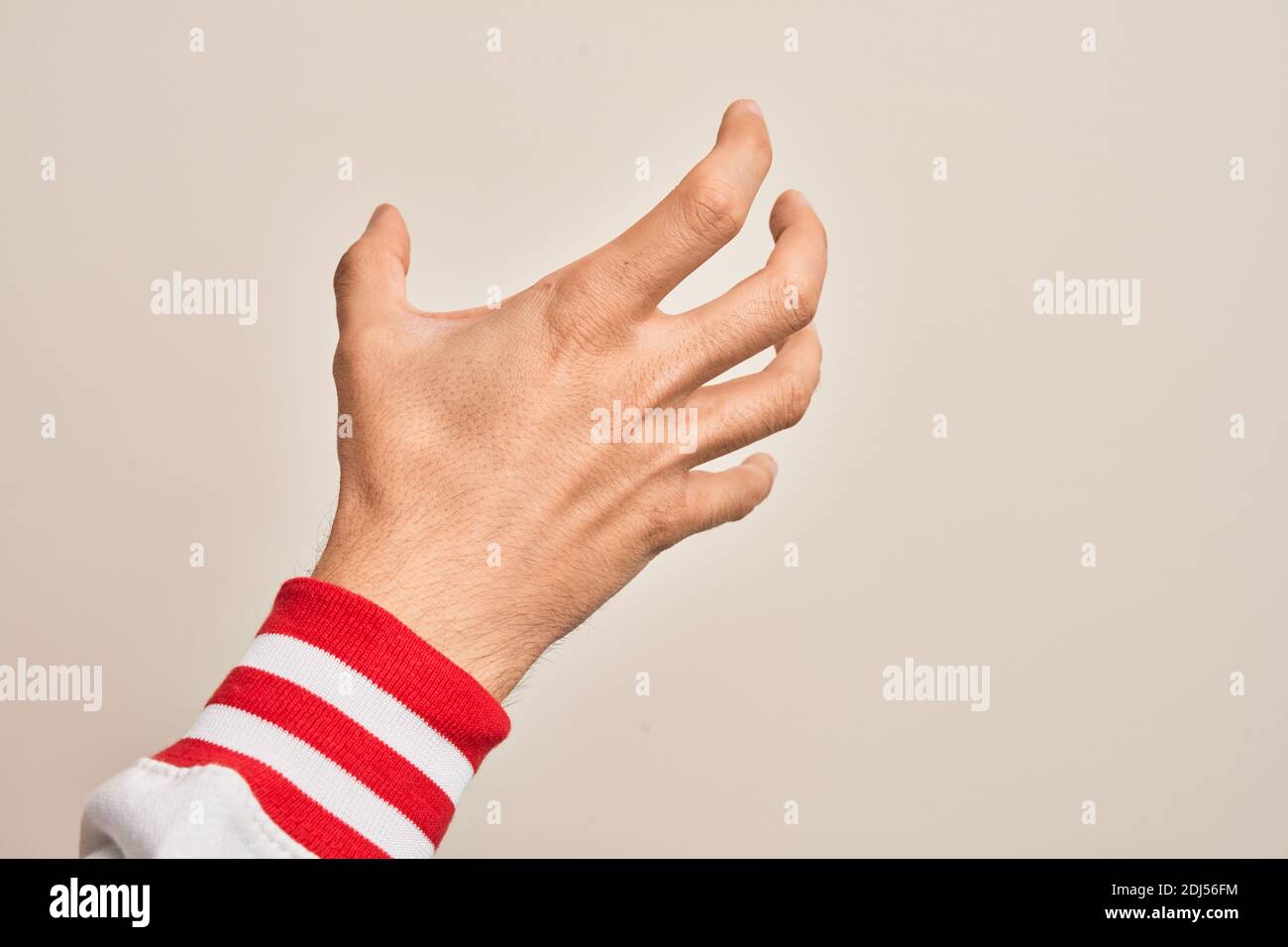Hand of caucasian young man showing fingers over isolated white ...