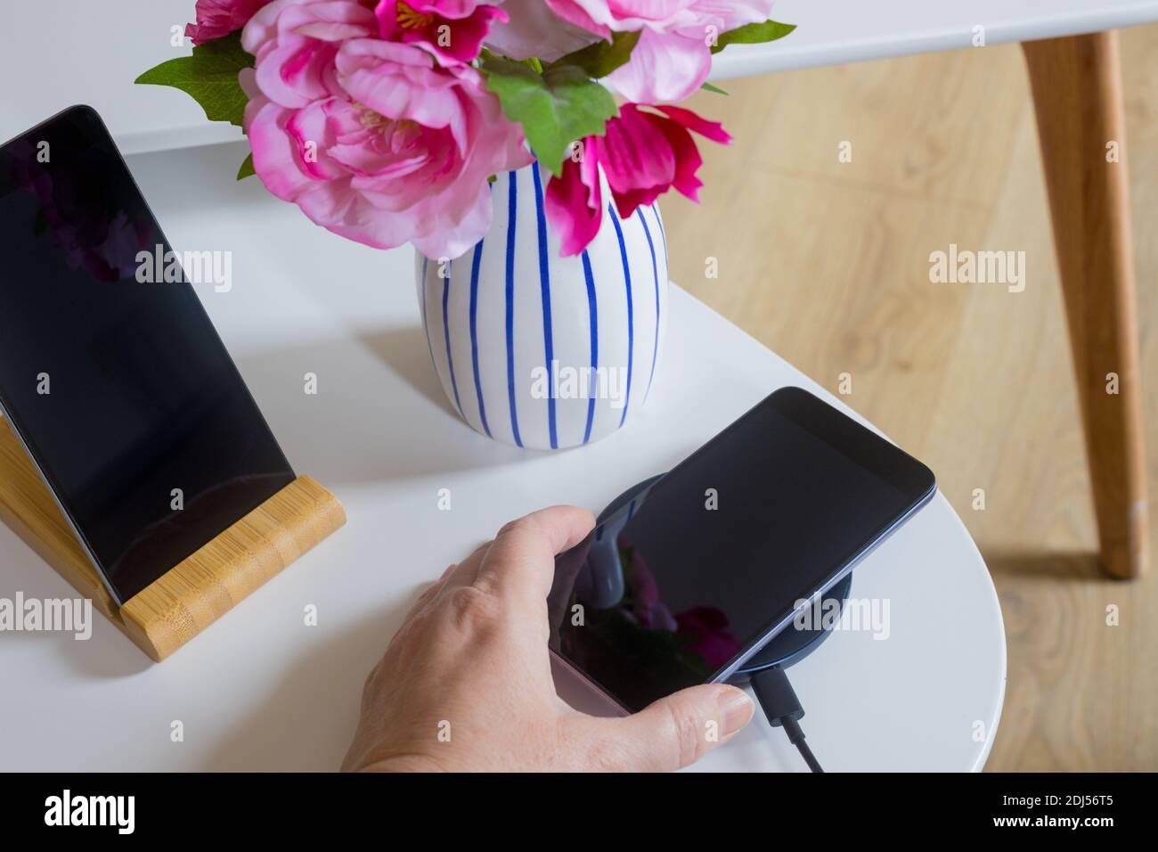 phone charging on the table in the apartment Stock Photo - Alamy