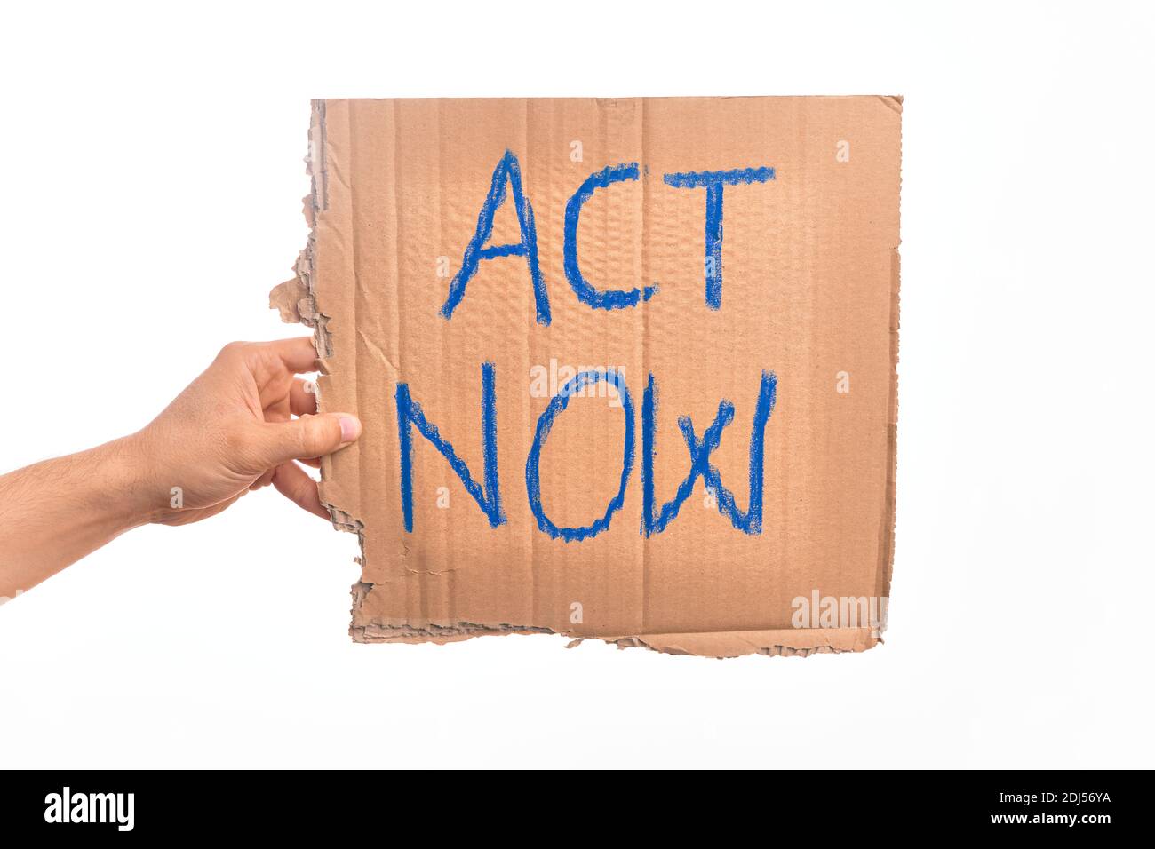 Cardboard banner ACT NOW text, take action now message over isolated ...