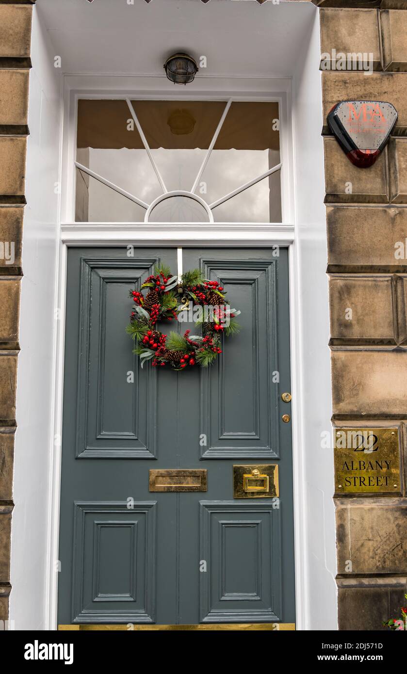 Decorative Christmas wreath on Georgian townhouse panelled front door ...