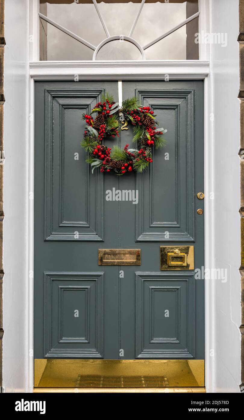 Decorative Christmas wreath on Georgian townhouse panelled front door ...