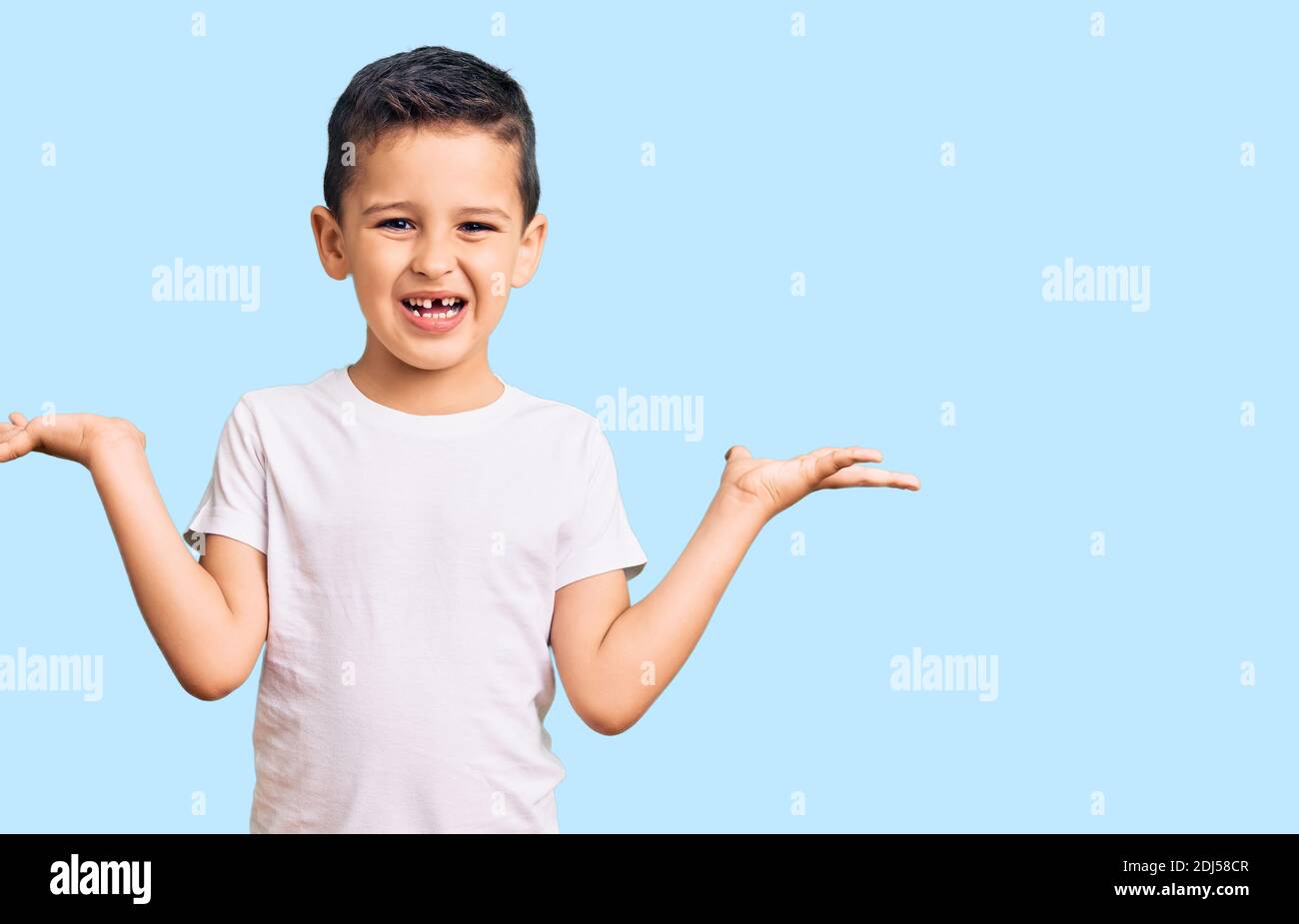 Little cute boy kid wearing casual white tshirt celebrating victory ...