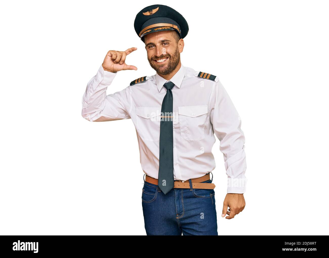 Handsome man with beard wearing airplane pilot uniform smiling and ...