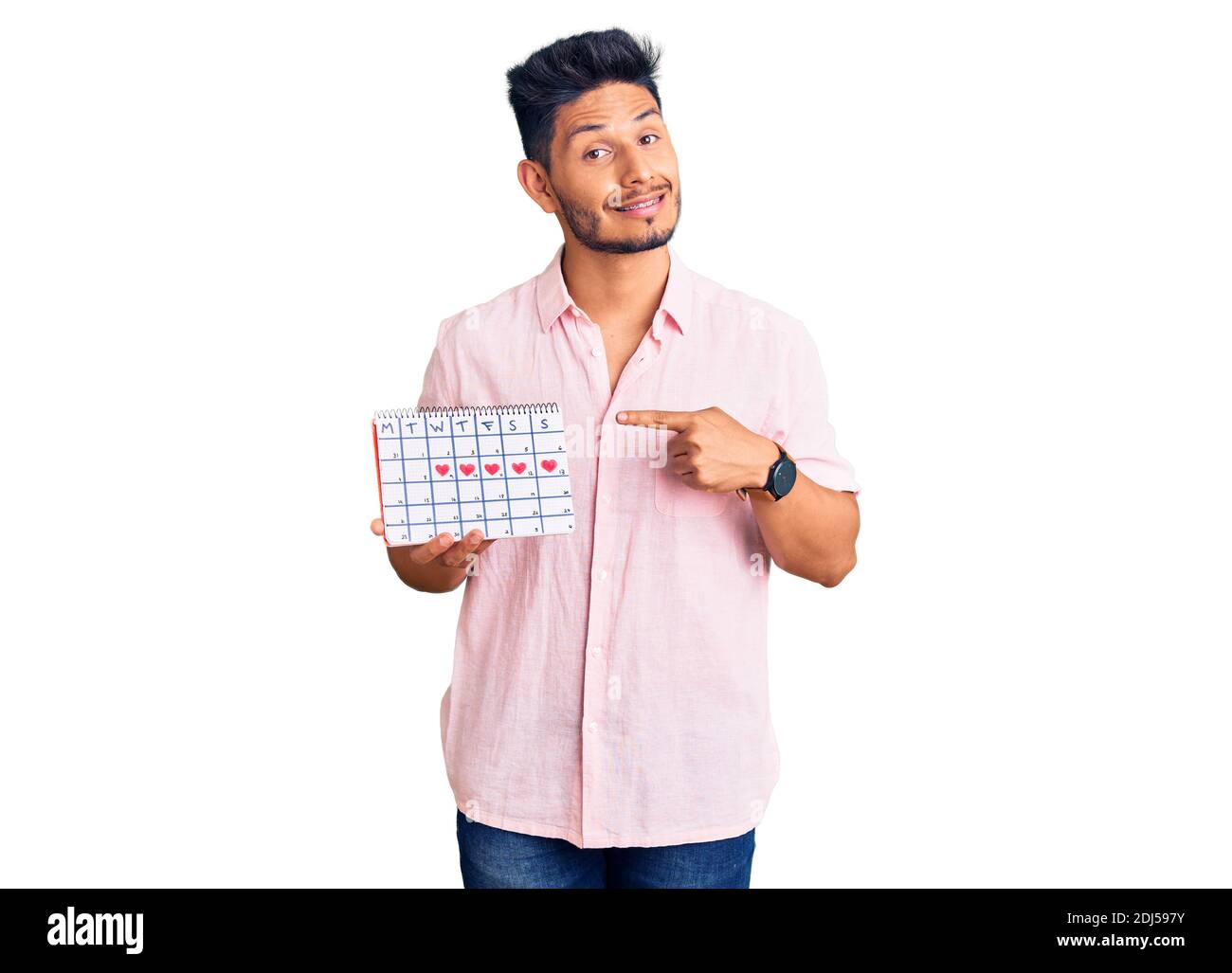 Handsome latin american young man holding heart calendar smiling happy ...