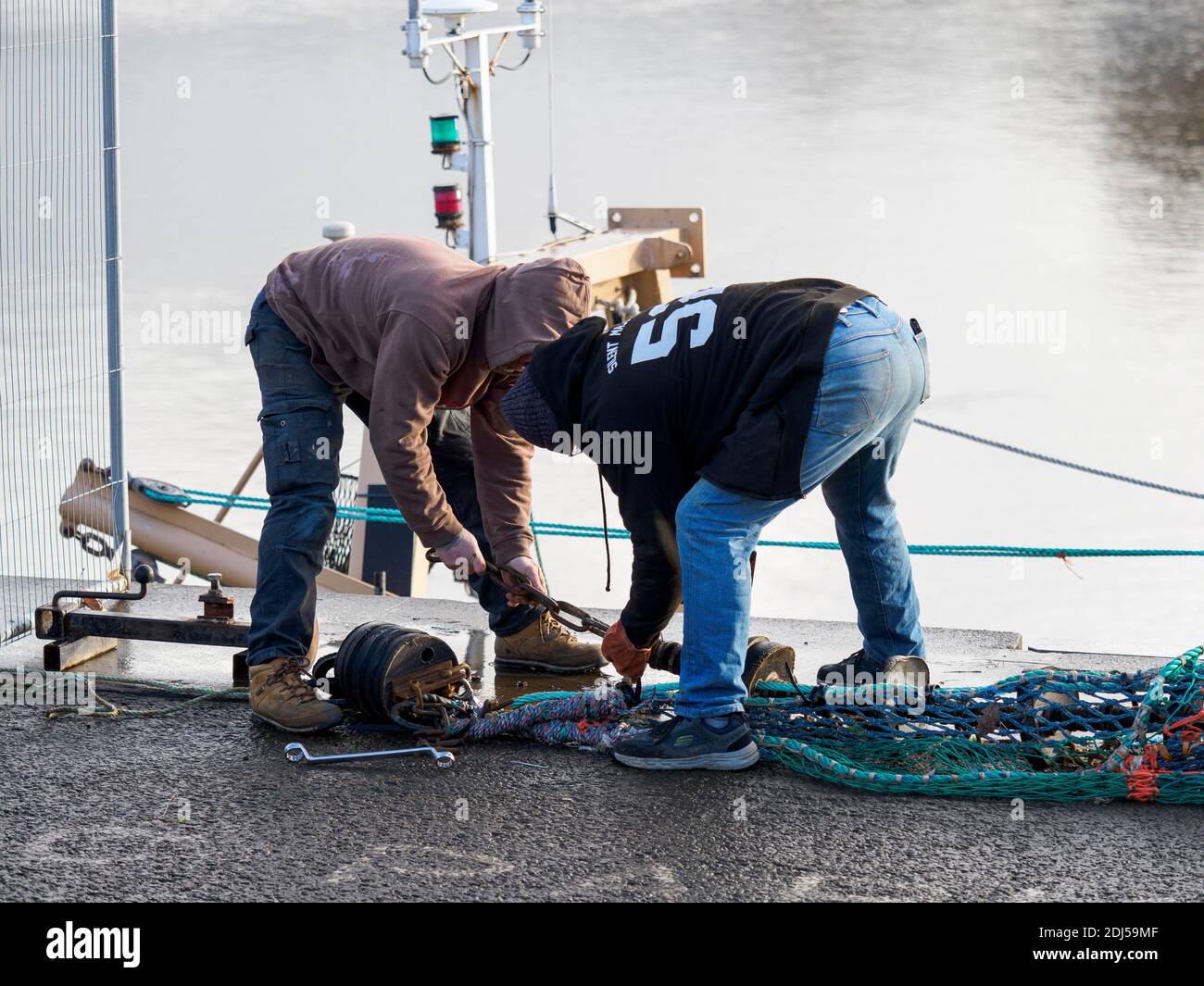 Repairing fixing net hi-res stock photography and images - Alamy