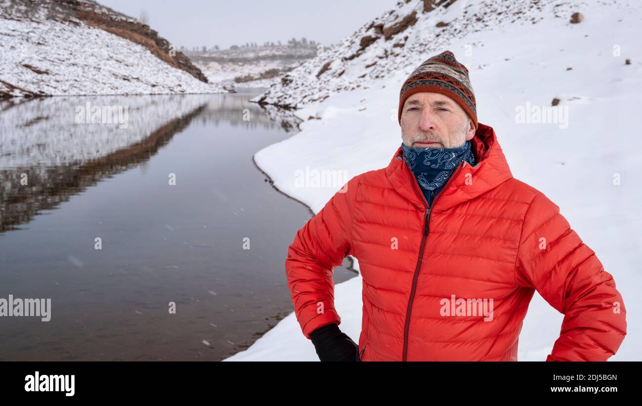 senior male hiker on a shore of Horsetooth Reservoir in Lory State Park ...