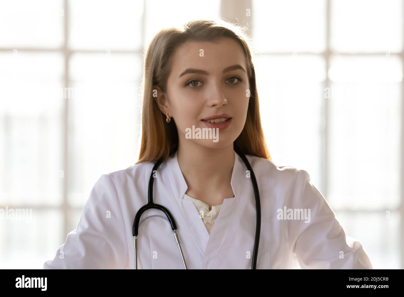 Profile picture of smiling female doctor pose at workplace Stock Photo ...