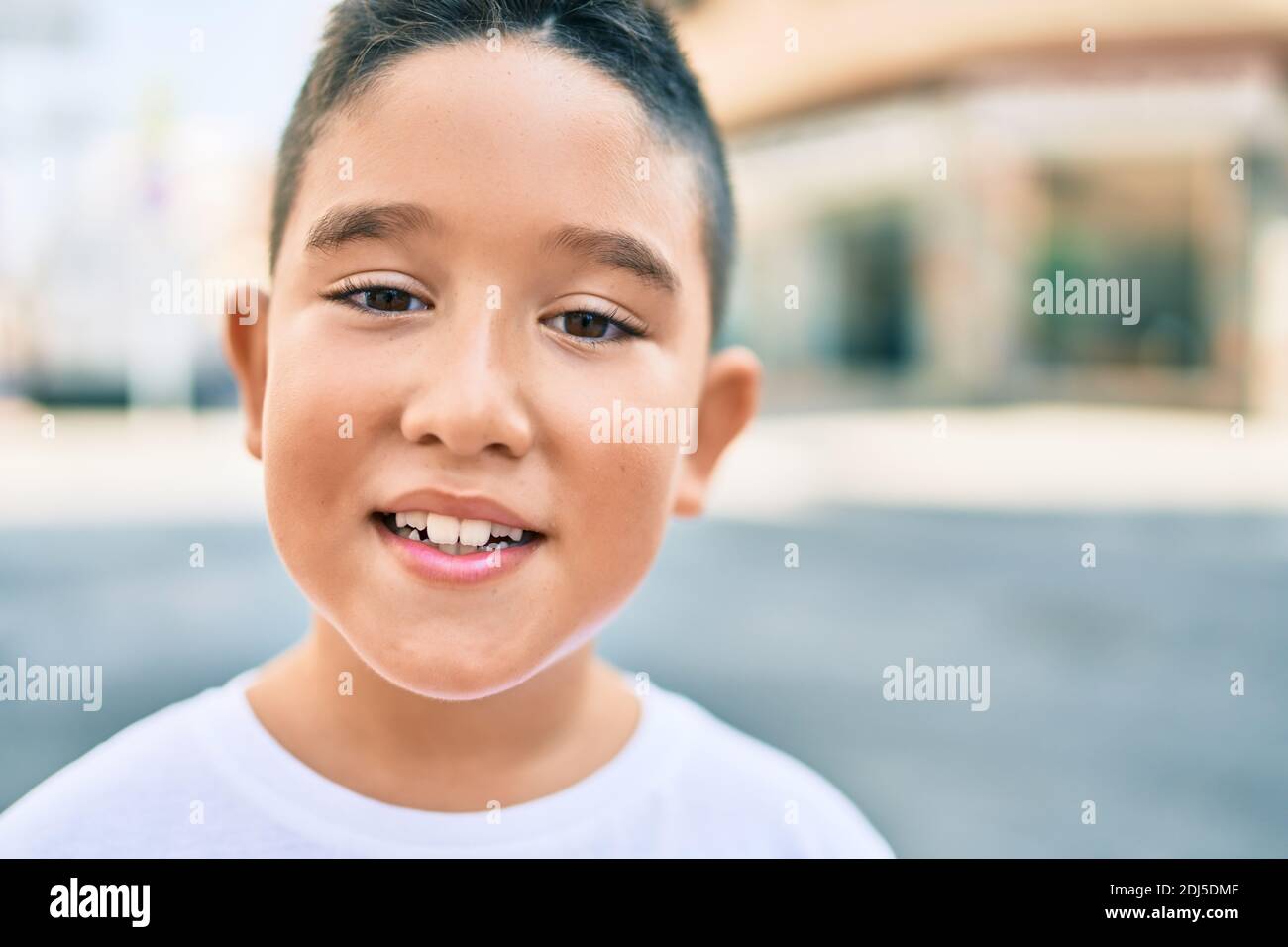 Adorable boy smiling happy standing at street of city Stock Photo - Alamy