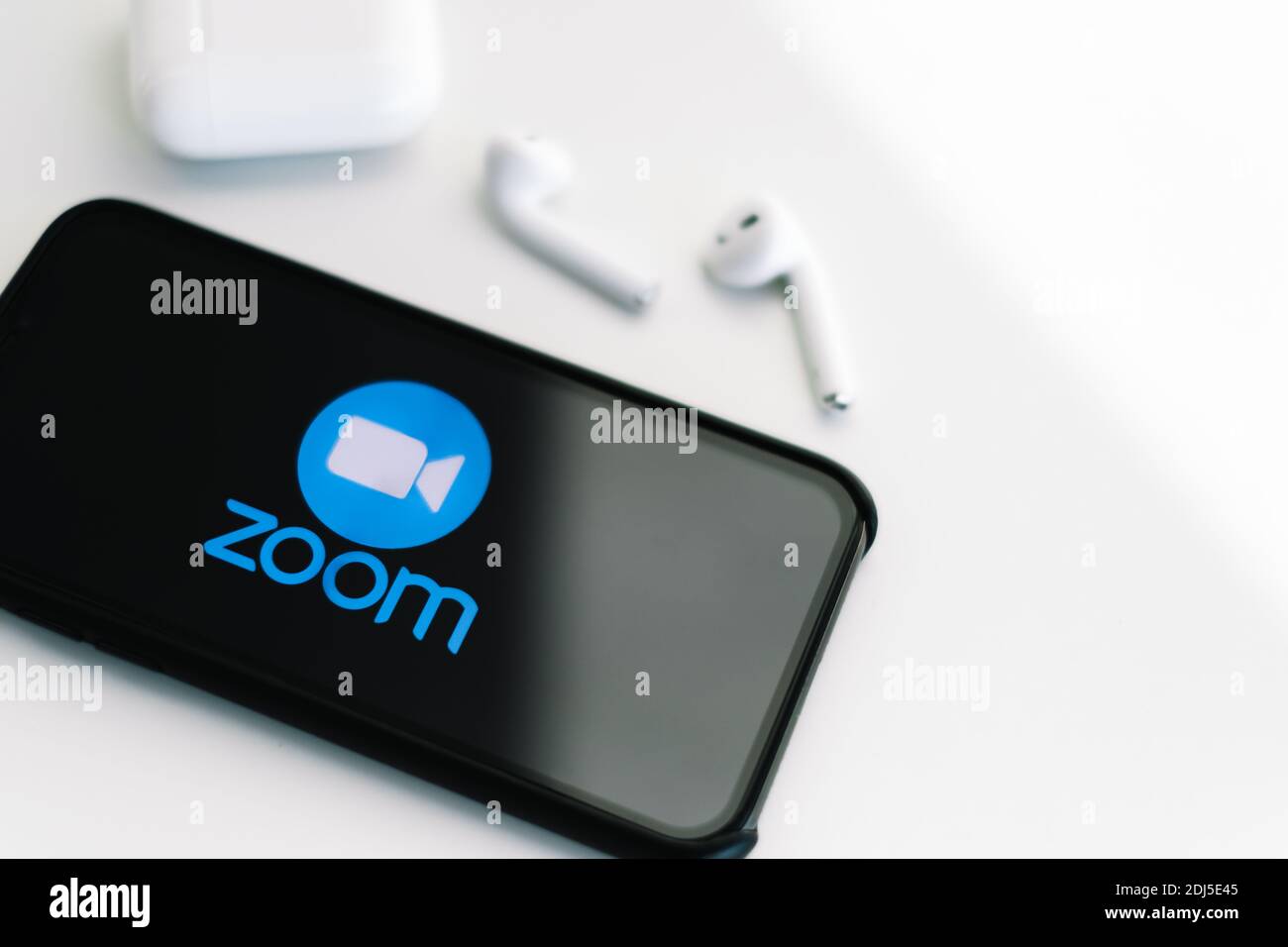 Zoom video conference app logo on the smartphone screen. High quality ...