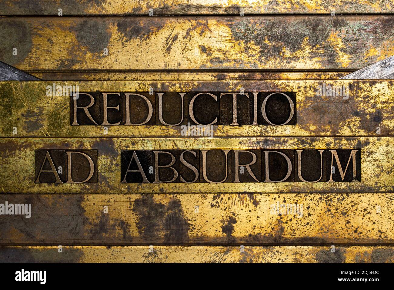 Reductio Ad Absurdum text on vintage textured bronze grunge copper and ...