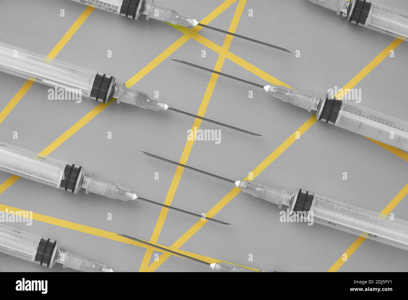 group syringes in yellow and gray and yellow background Stock Photo - Alamy