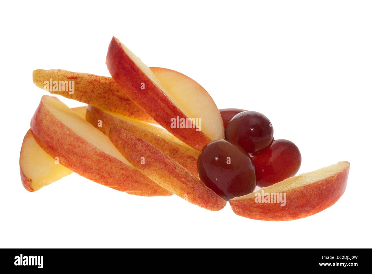 Slices of apple with grapes - white background Stock Photo - Alamy