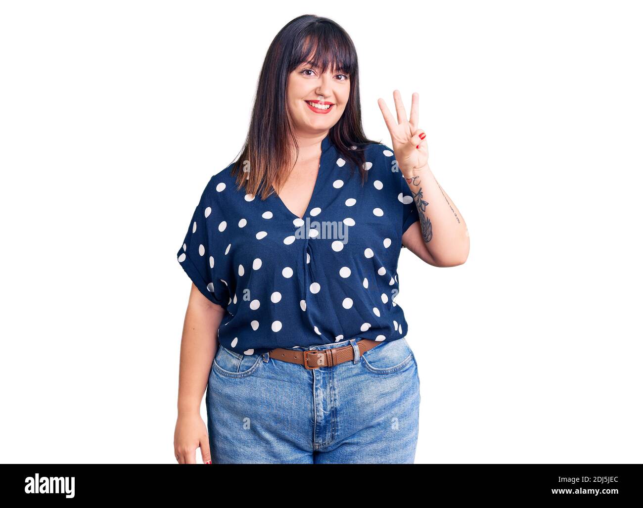 Young plus size woman wearing casual clothes showing and pointing up ...