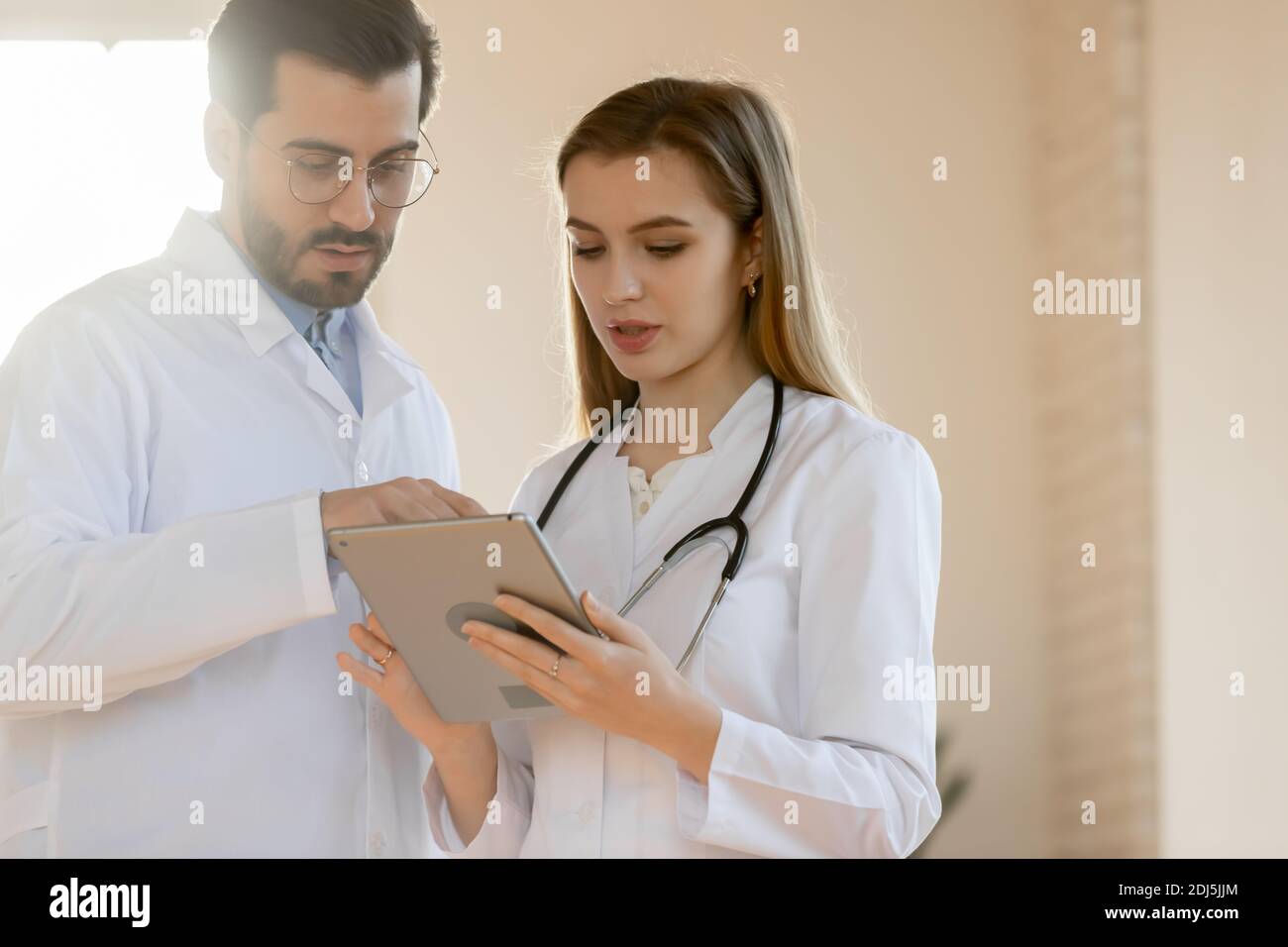 Diverse healthcare worker with patient hi-res stock photography and ...